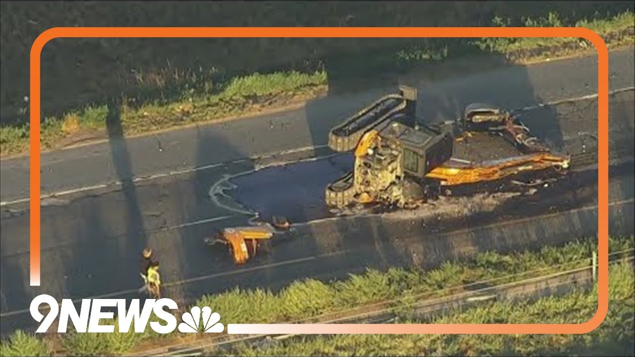 Driver who was towing excavator charged after bridge debris fatally ...