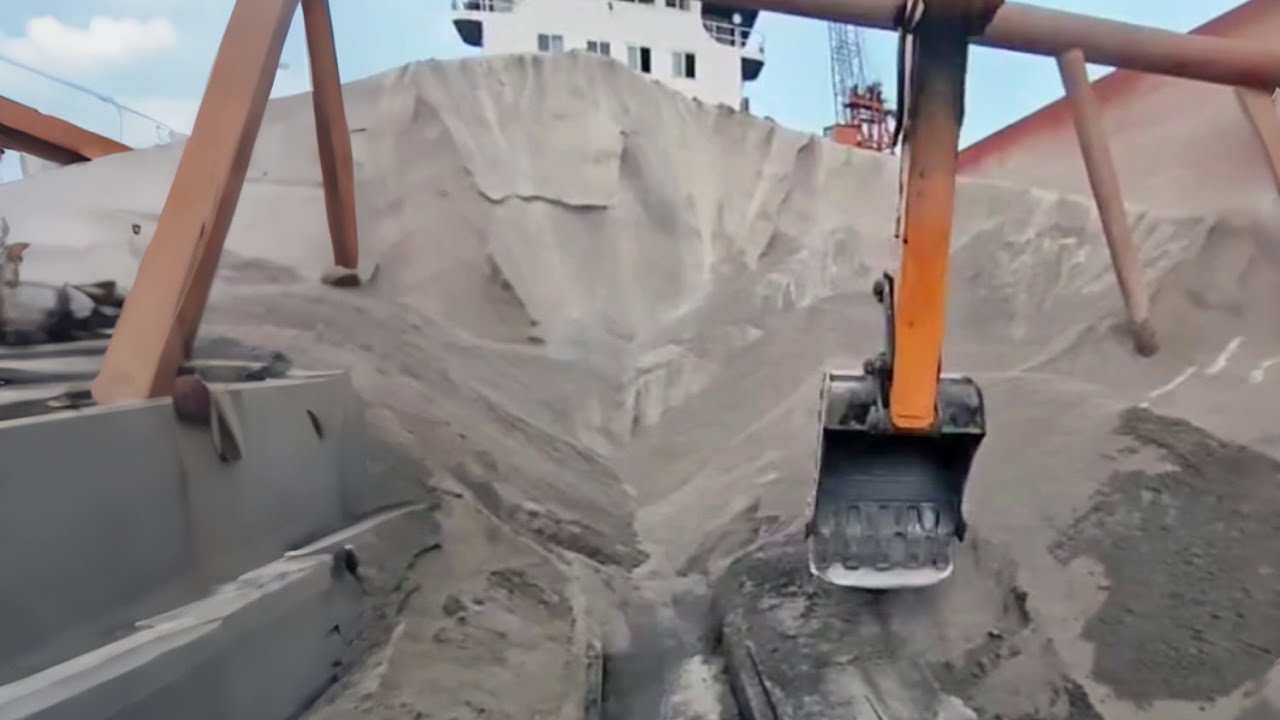 Barge unloading 1800 tons of river sand - excavator working on barge ...