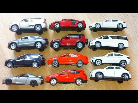 Overview of bright colored small cars from a big box - YouTube