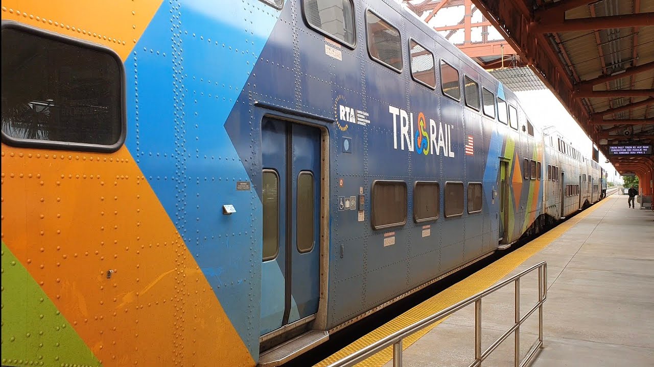 TRI RAIL passenger train leaves train station in Florida United States ...