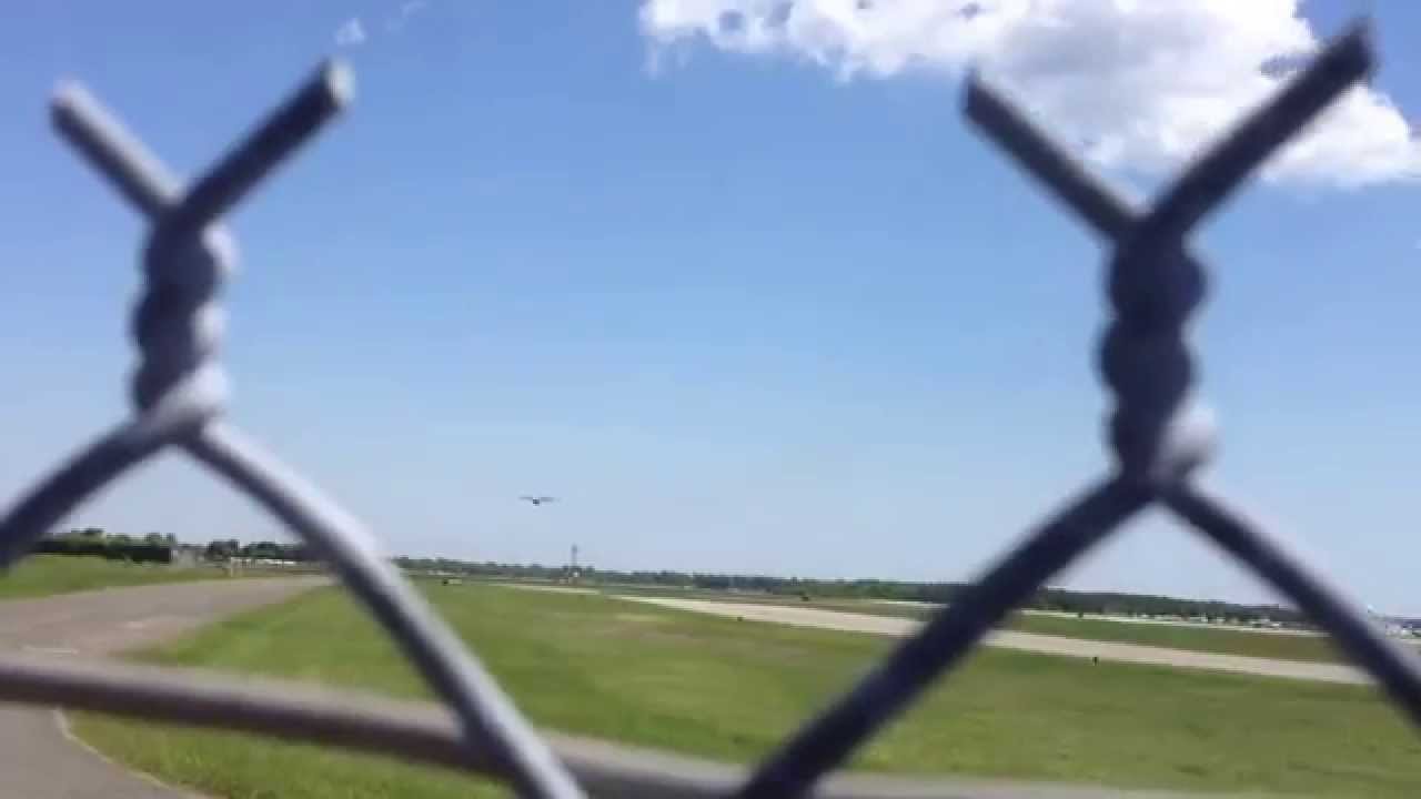 Airplane buzzing the tower at Republic Airport - YouTube