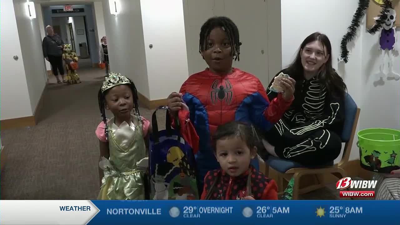 Washburn residents hall hosts warm indoor trick or treat event - YouTube