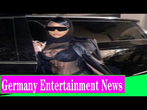 Megan Thee Stallion shows off her incredible curves in a revealing see through fishnet dress as she