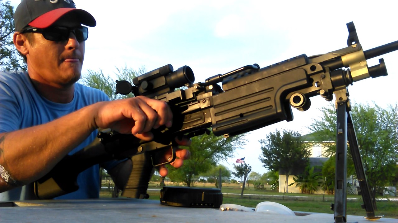Firing the M249-22 - YouTube