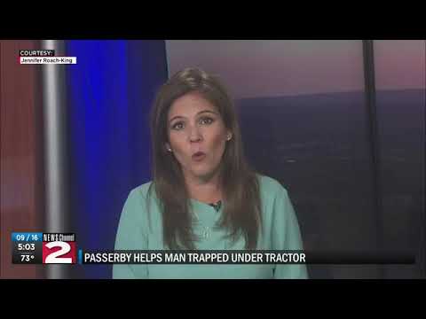 Passerby helps man trapped under tractor - YouTube