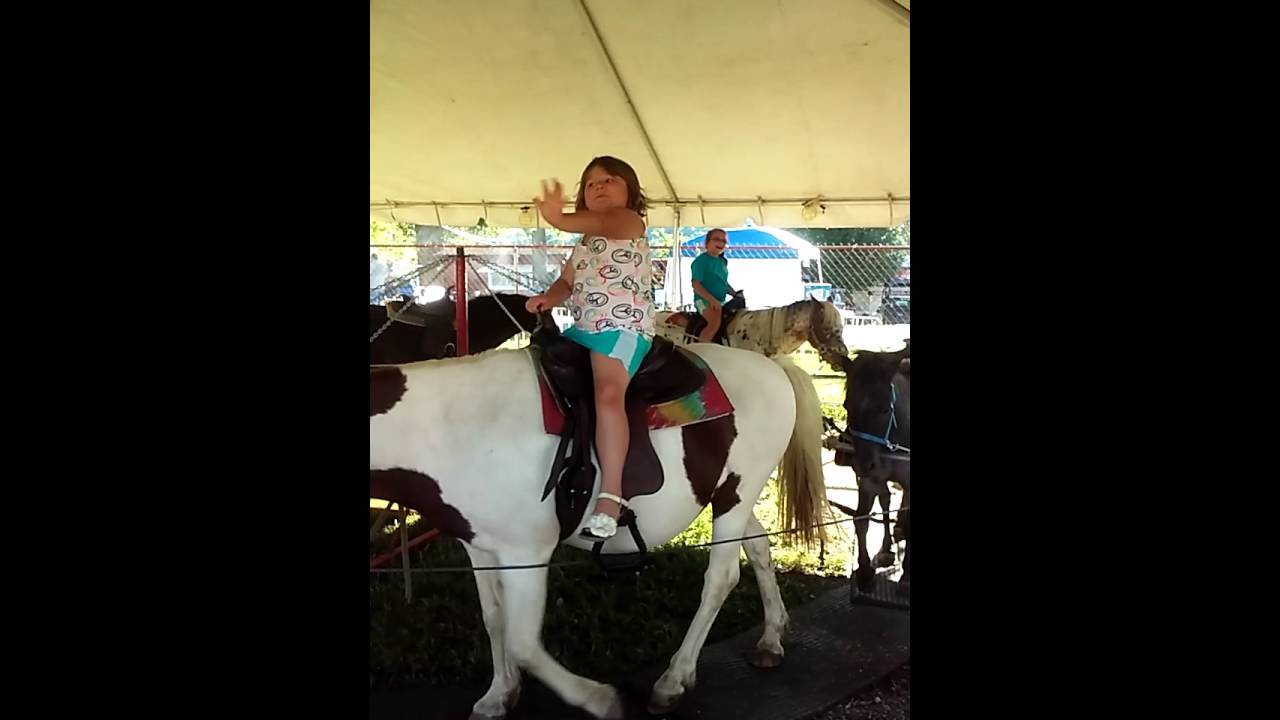 Riding the ponys at the fair - YouTube