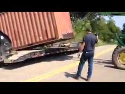 Loading shipping container on low boy - YouTube