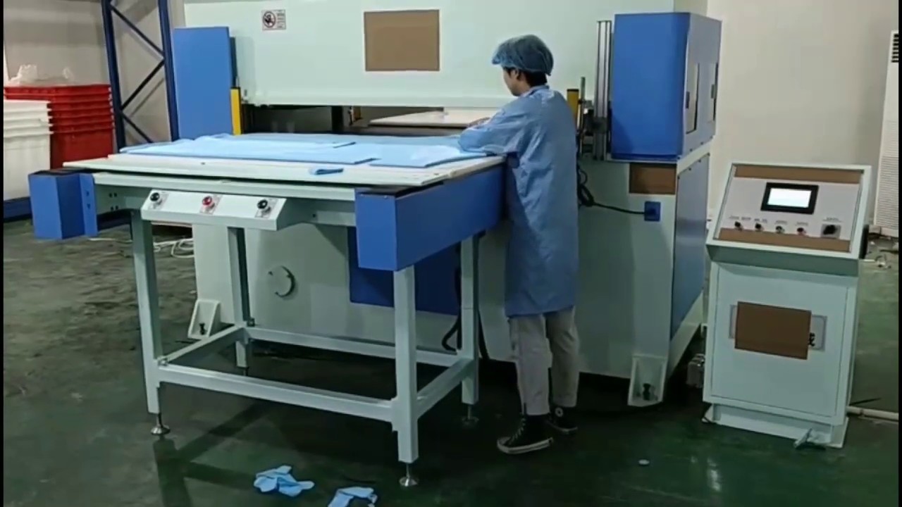 Automatic protective clothing cutting machine - YouTube