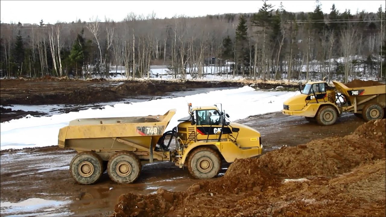 CAT 345D Excav Loads CAT 740 Trucks - YouTube