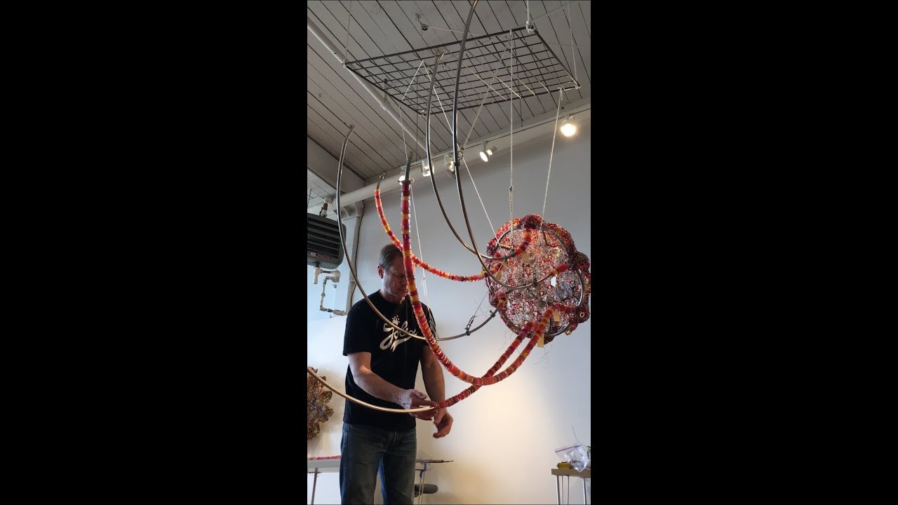 Glass artist Kait Rhoads creating a giant jellyfish chandelier out of ...