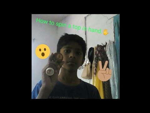 How to spin a top in hand👋 - YouTube