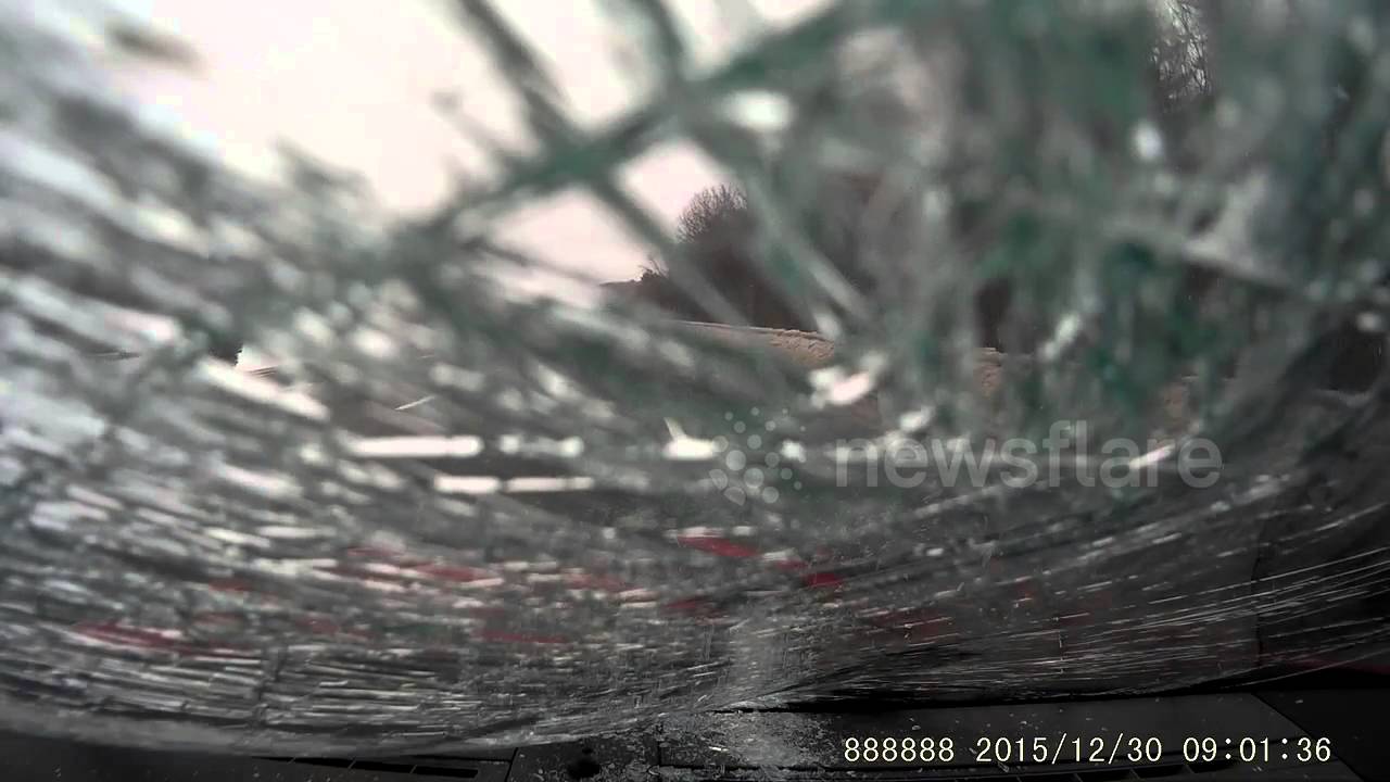 Flying ice sheet smashes car windscreen in US - YouTube
