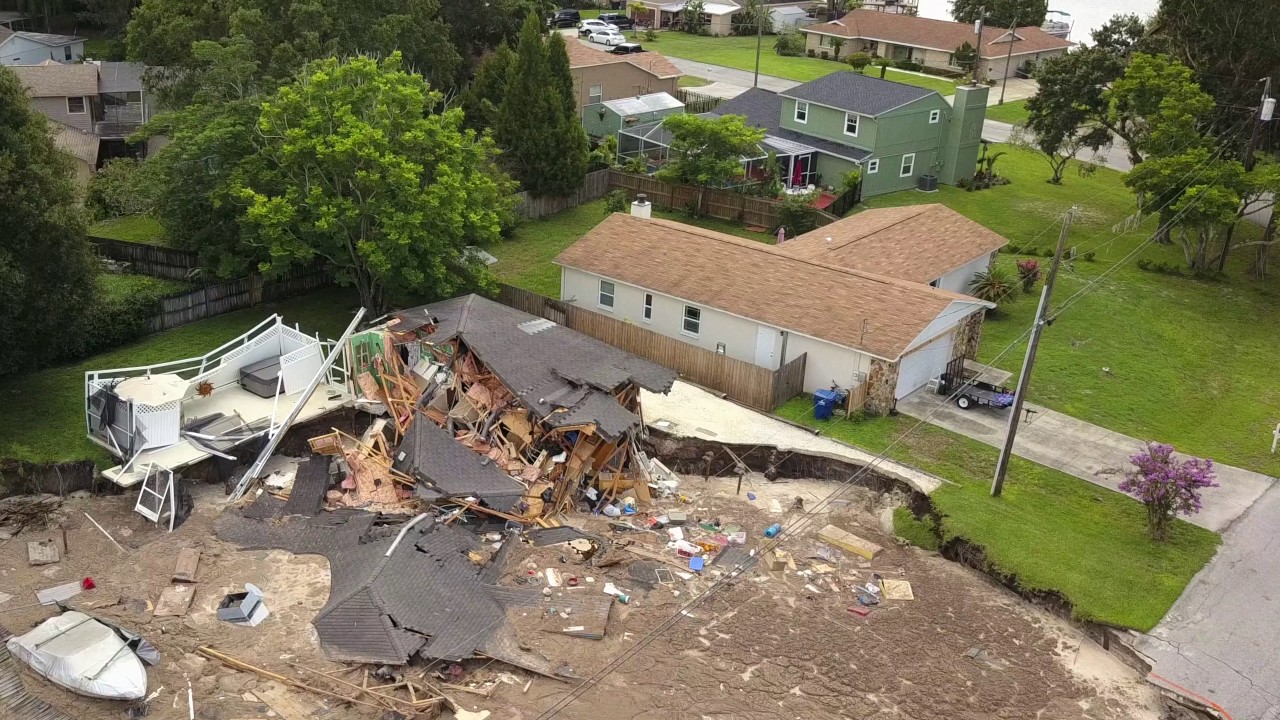 Massive Sinkhole Swallows Two Homes in Pasco County Florida - YouTube