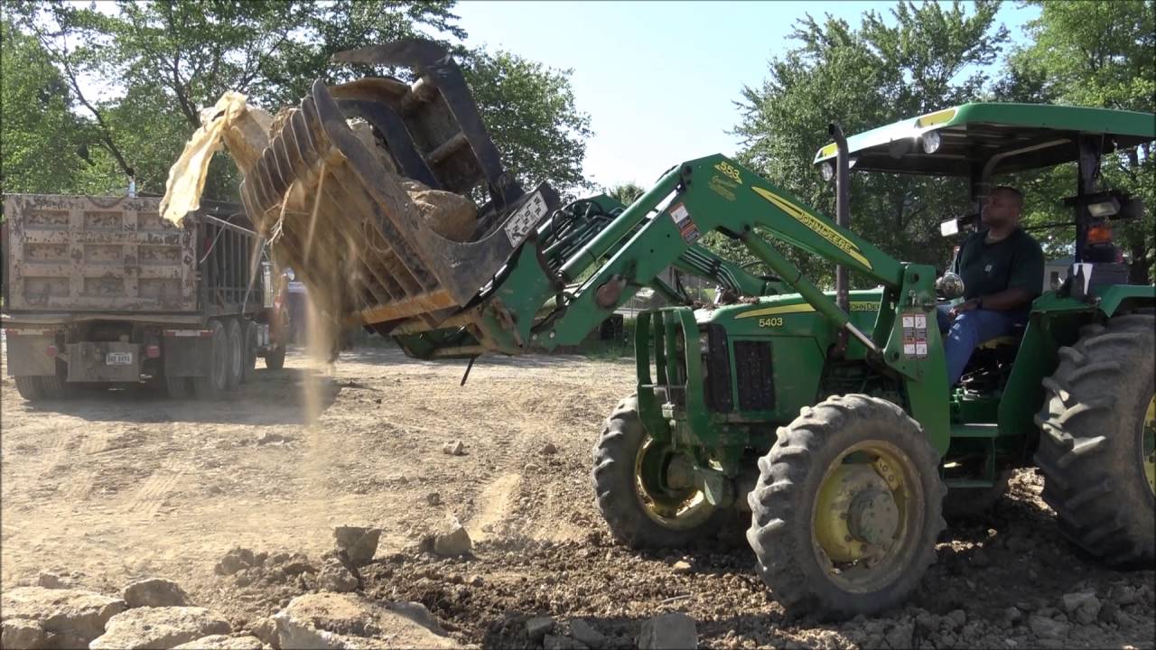 Loading Concrete with JD5403 and WRLong Grapple Bucket - YouTube
