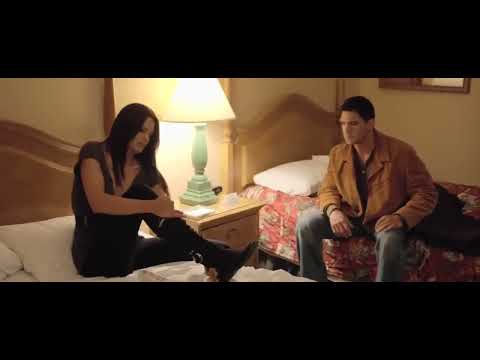 Stana Katik takes her boot off wearing black socks