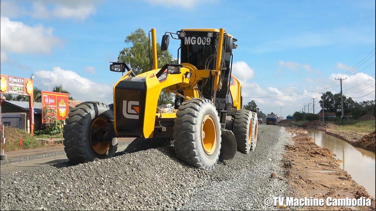 Grading gravel road by new motor grader with driver skill ...