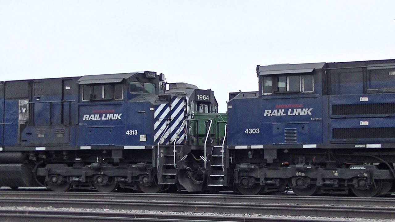 MRL SD70ACe's 4313 and 4303 waiting in Glendive East, plus BNSF 606. - YouTube
