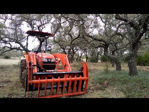#01 Kubota L2501 Grapple Clearing Cedar Trees - YouTube