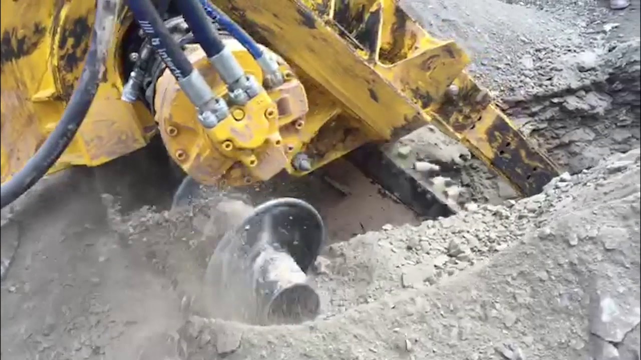 MH100 hydraulic trencher laying cables in the Himalayas - YouTube