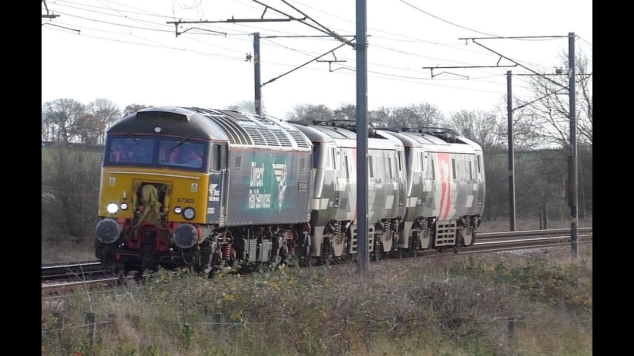 Europhoenix class 91's 91117 and 91120 dragged by DRS 57303. - YouTube