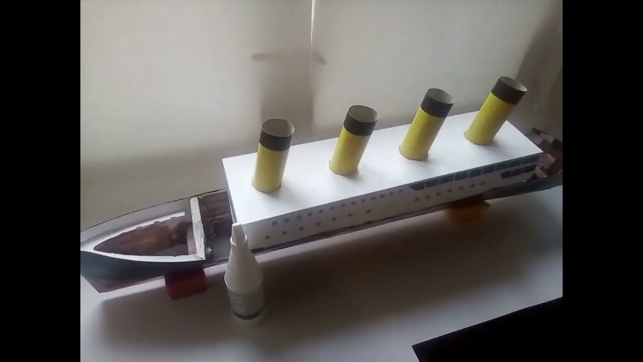 Titanic model out of paper. Model Titanic sinking in the pond. - YouTube