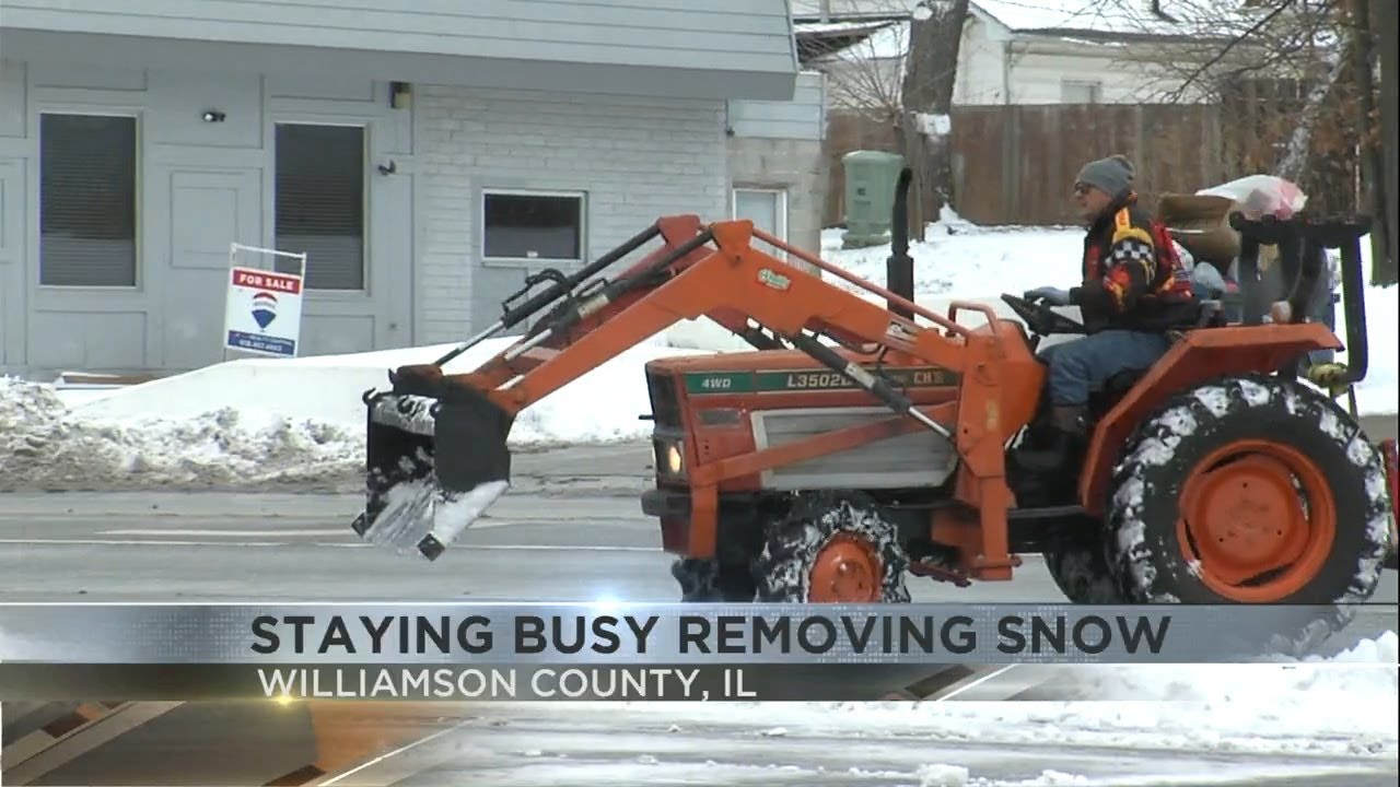 local snow removal company working to keep other businesses open - YouTube