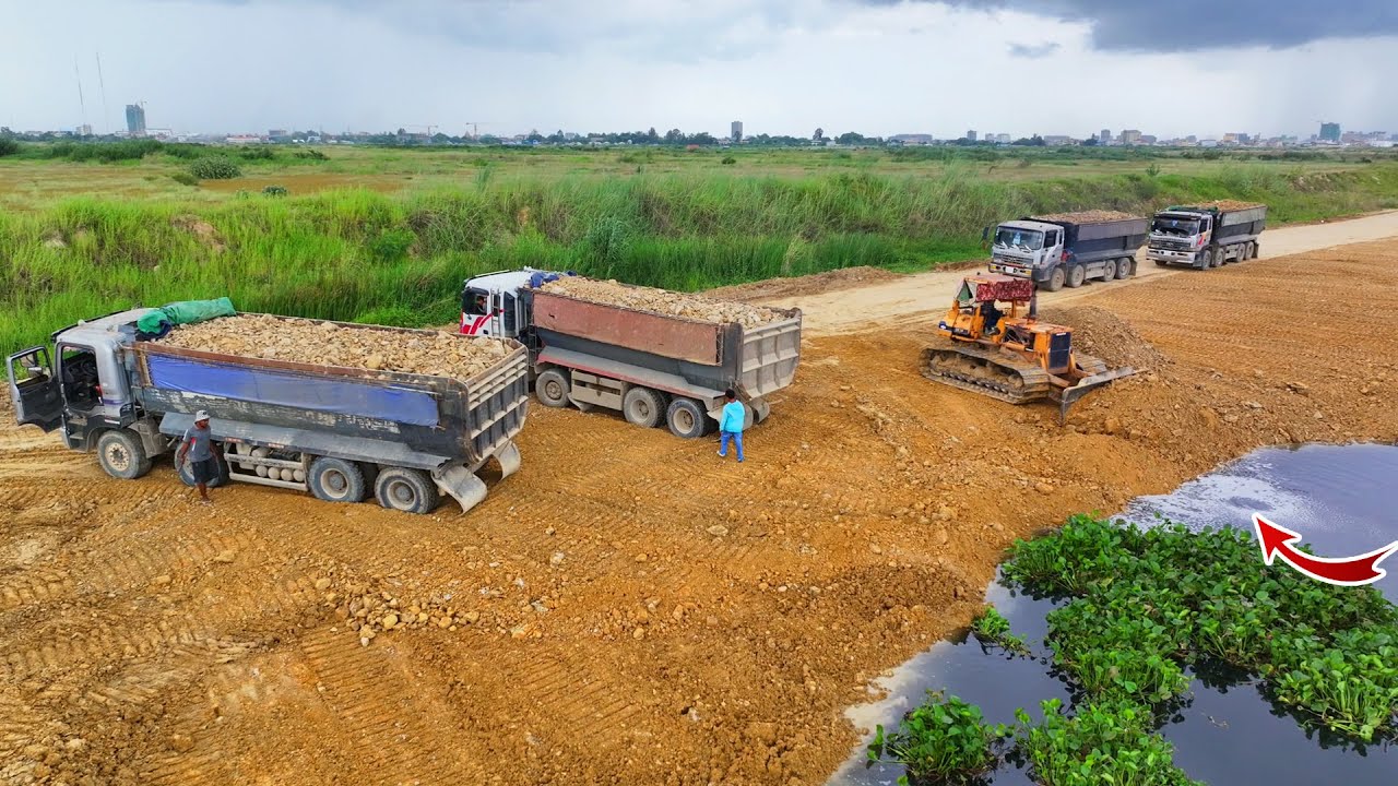 Excellent Skill Dumping Soil Into Deep Water By Dump Trucks And Dozer ...
