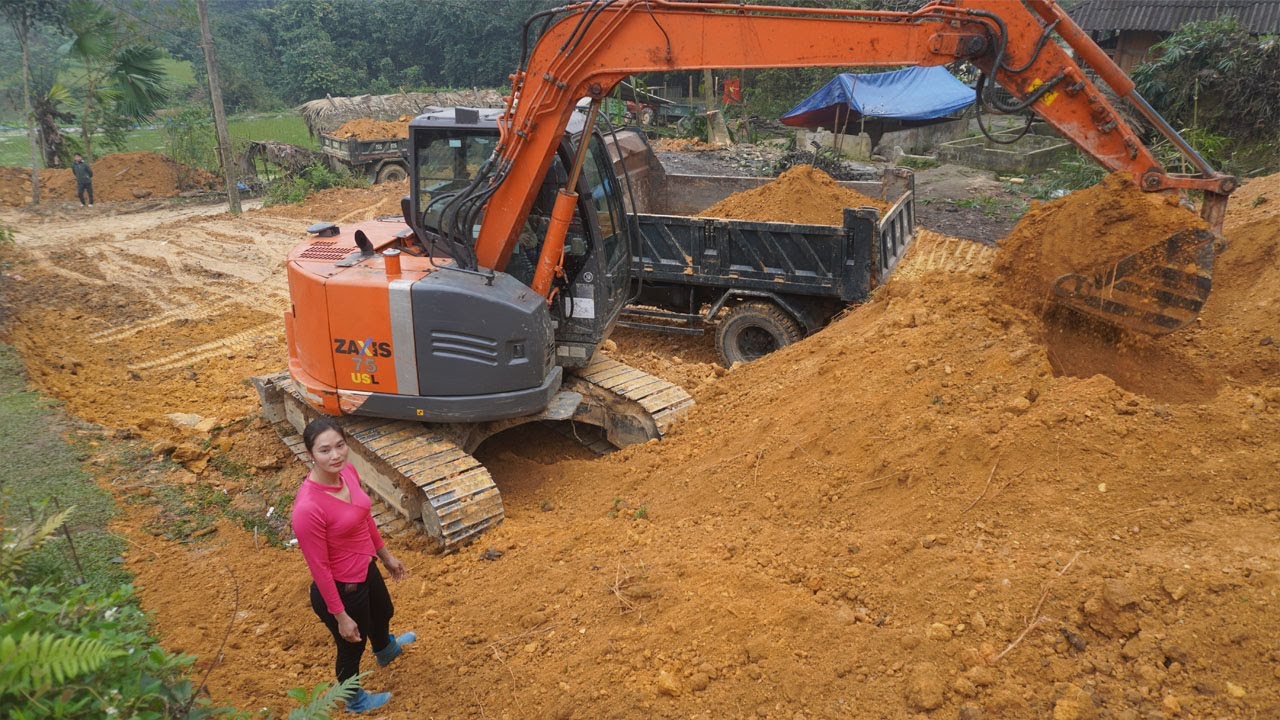 Excavators and trucks worked hard to level 1000 cubic meters of earth ...