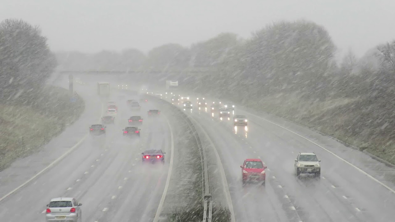 Snow falling on M62 motorway over Chat Moss, Irlam: 21st January 2018 ...