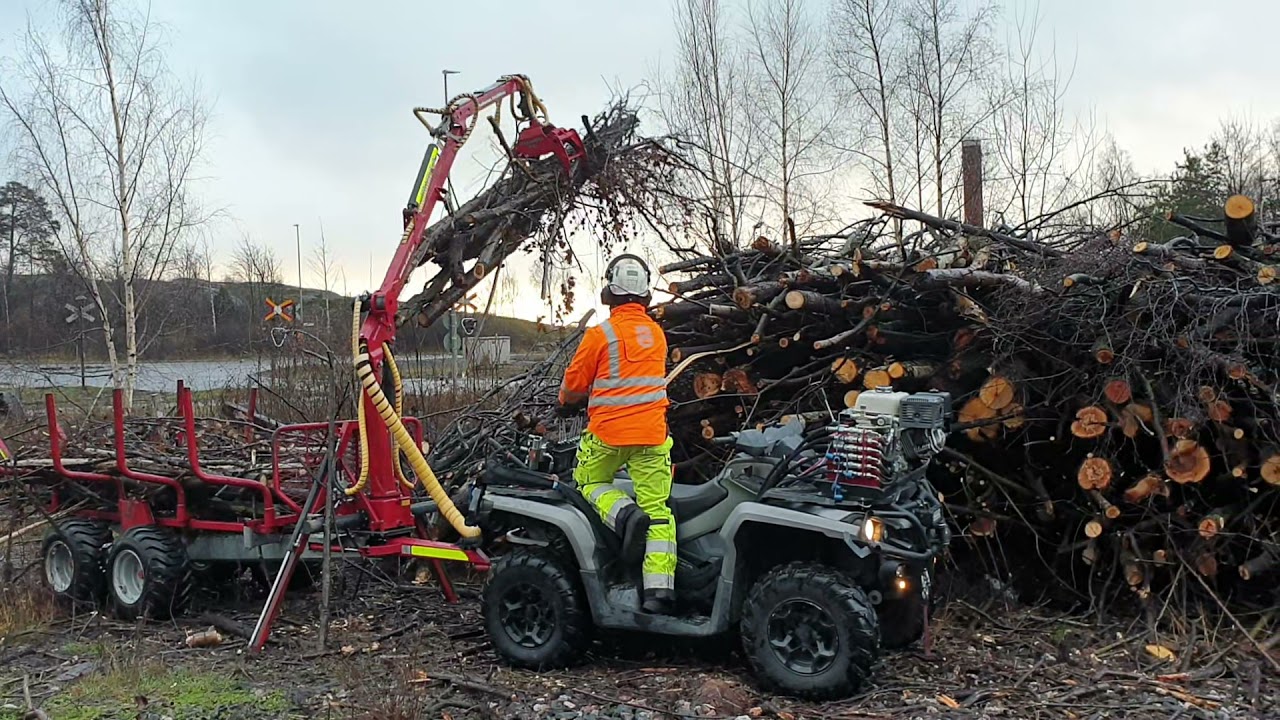 Unloading branches - Kranman T1900 atv trailer - YouTube