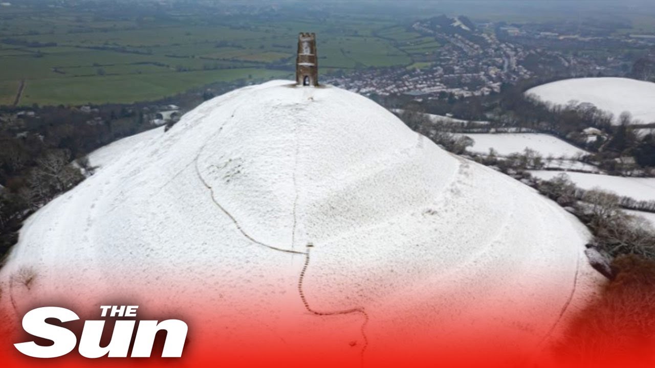 Snow hits Britain as cold snap causes travel chaos and schools to close ...