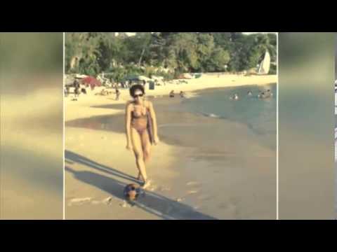 Rihanna in hysterics playing soccer on beach