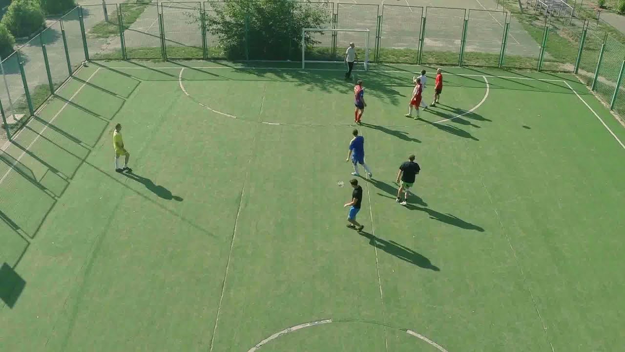 Group of young men playing soccer on pitch, sports aerial. Stock ...