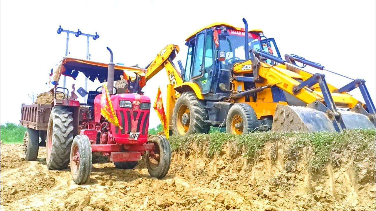 New Jcb 3dx Backhoe Loader Machine Loading Red Mud In Mahindra 475 DI ...