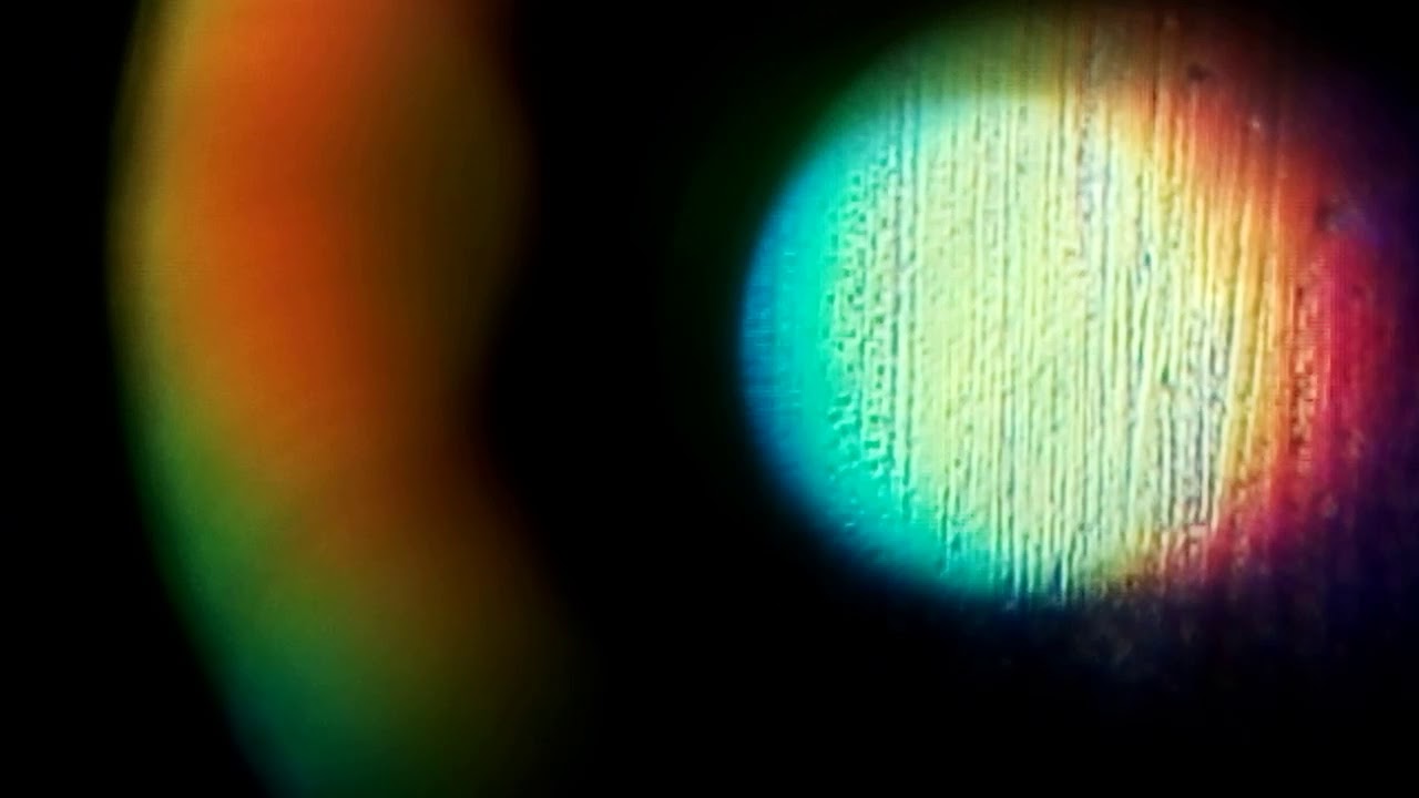 DVD grooves under the microscope (100x) - YouTube