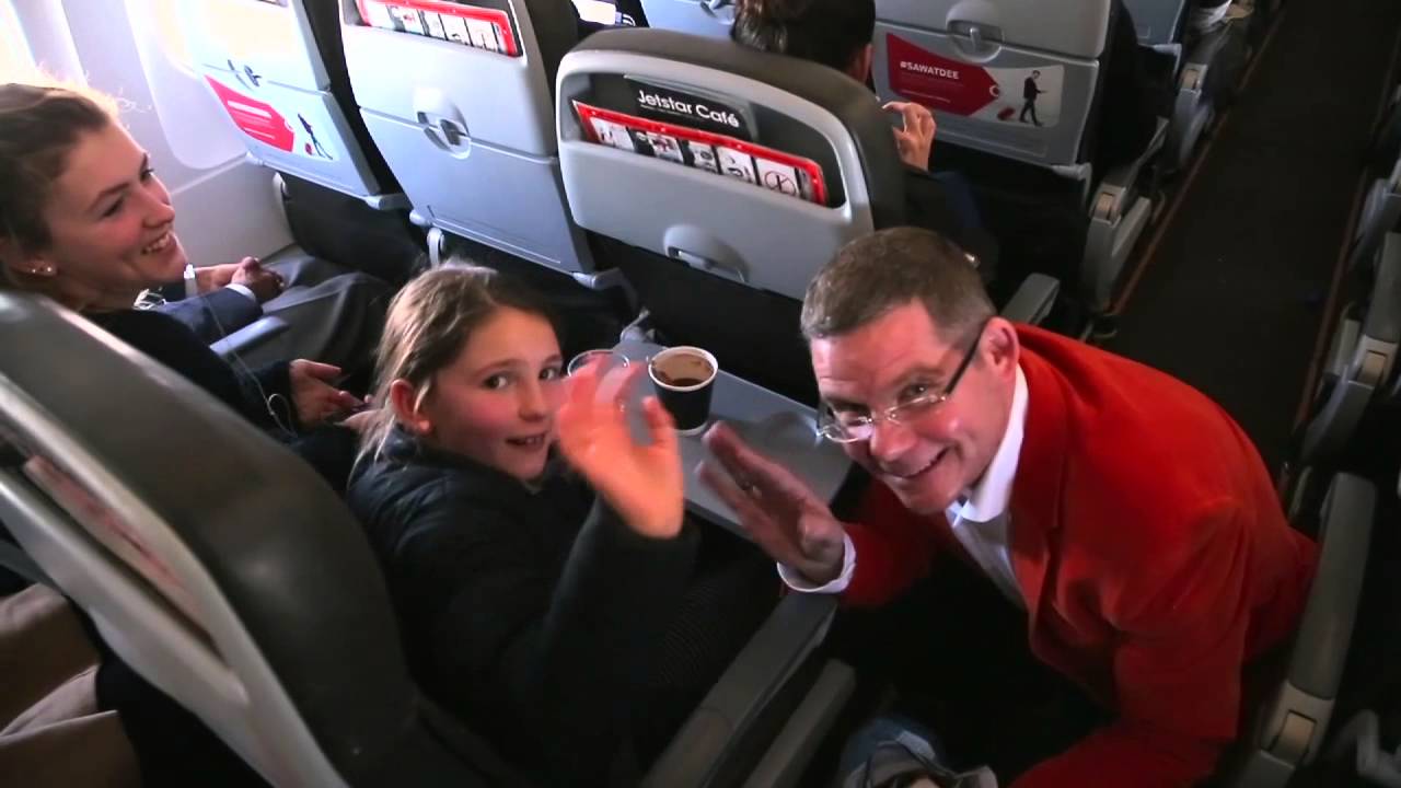Jetstar chief turns onboard barista for StarKids - YouTube
