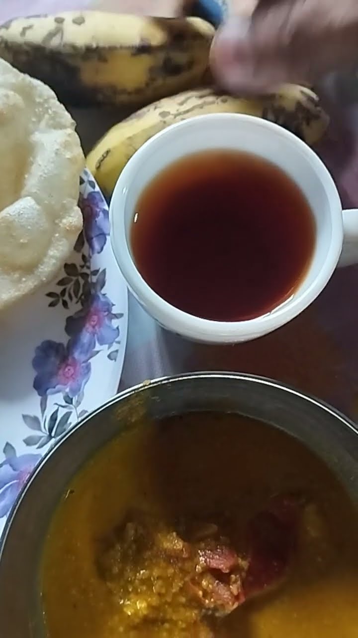 puri mix achar fish curry with sarso black tea. banana #morning ...