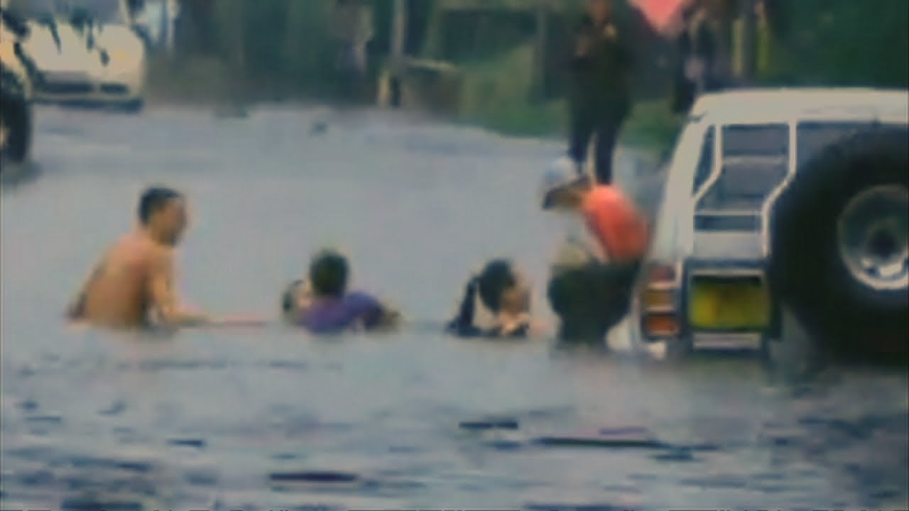 Children rescued after car becomes trapped in flood water - YouTube