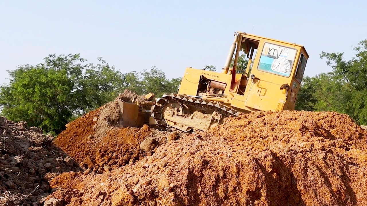 Powerful Bulldozer Working To Pushing dirt Constructs New Project with ...
