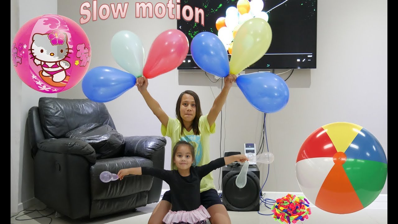 Balloon popping in Slow Motion - YouTube