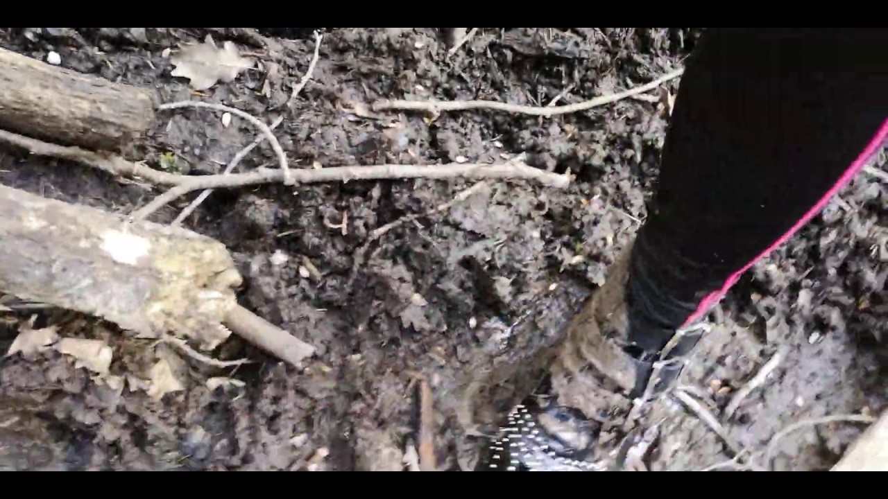 Studded boots sinking in mud - YouTube