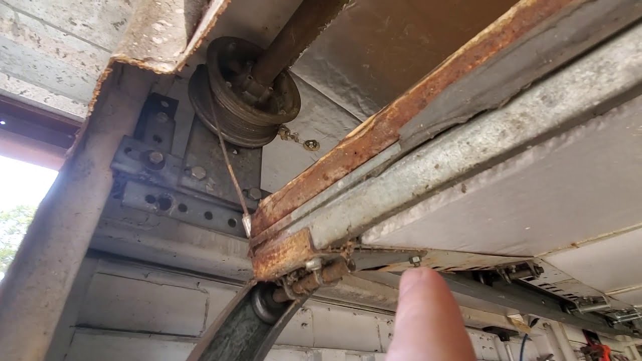 Building a shipping container garage, Garage door install review - YouTube