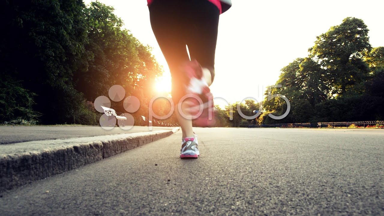 Road Runner Woman Running In Park In The Morning Motion Track High ...