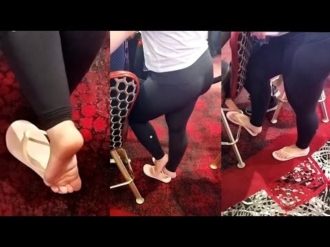 Candid casino woman taking off her sandals she just can't keep them on