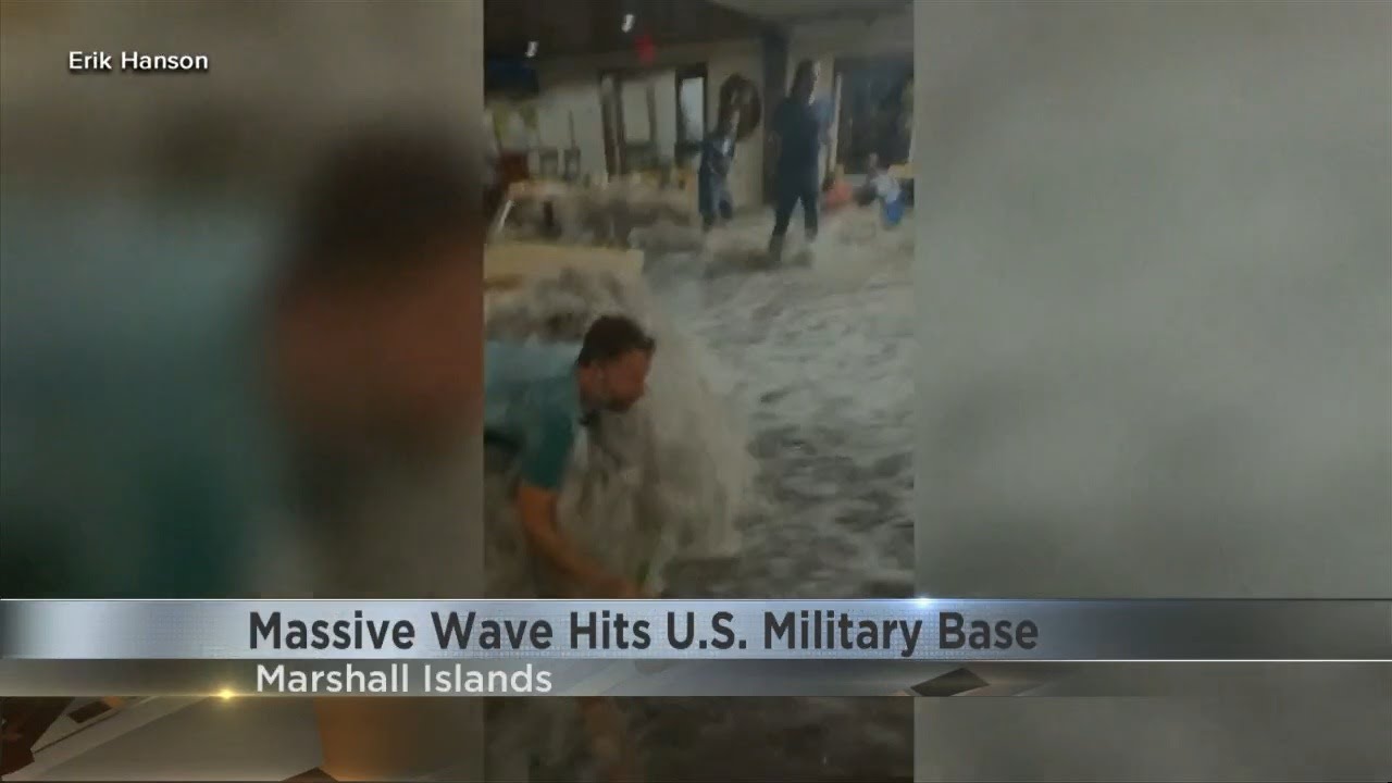 Rogue wave slams shore of US military base - YouTube
