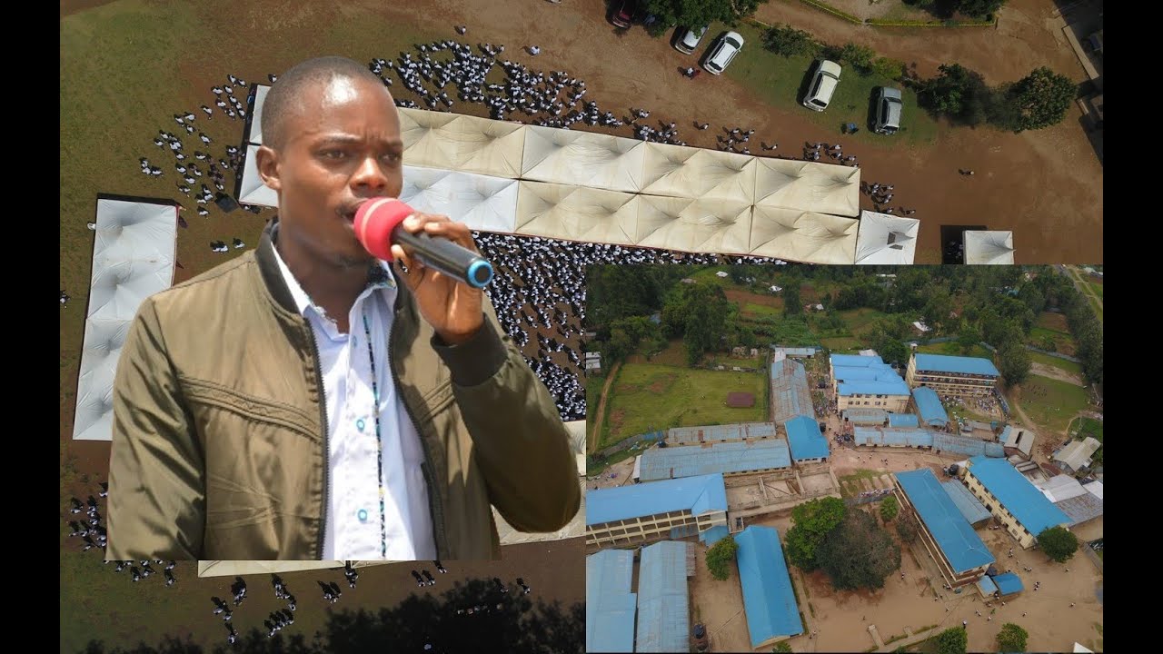 Mr. Victor Ubaga presenting a song during Friends School Keveye Girls ...