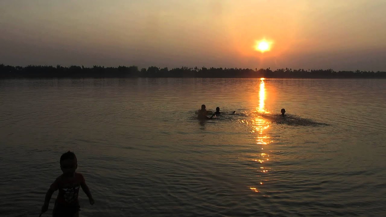 Taking a bath a long Mekong River with Sun set - YouTube