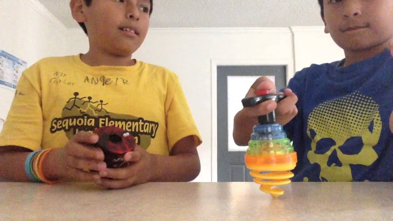 Playing trompos in laundry room - YouTube