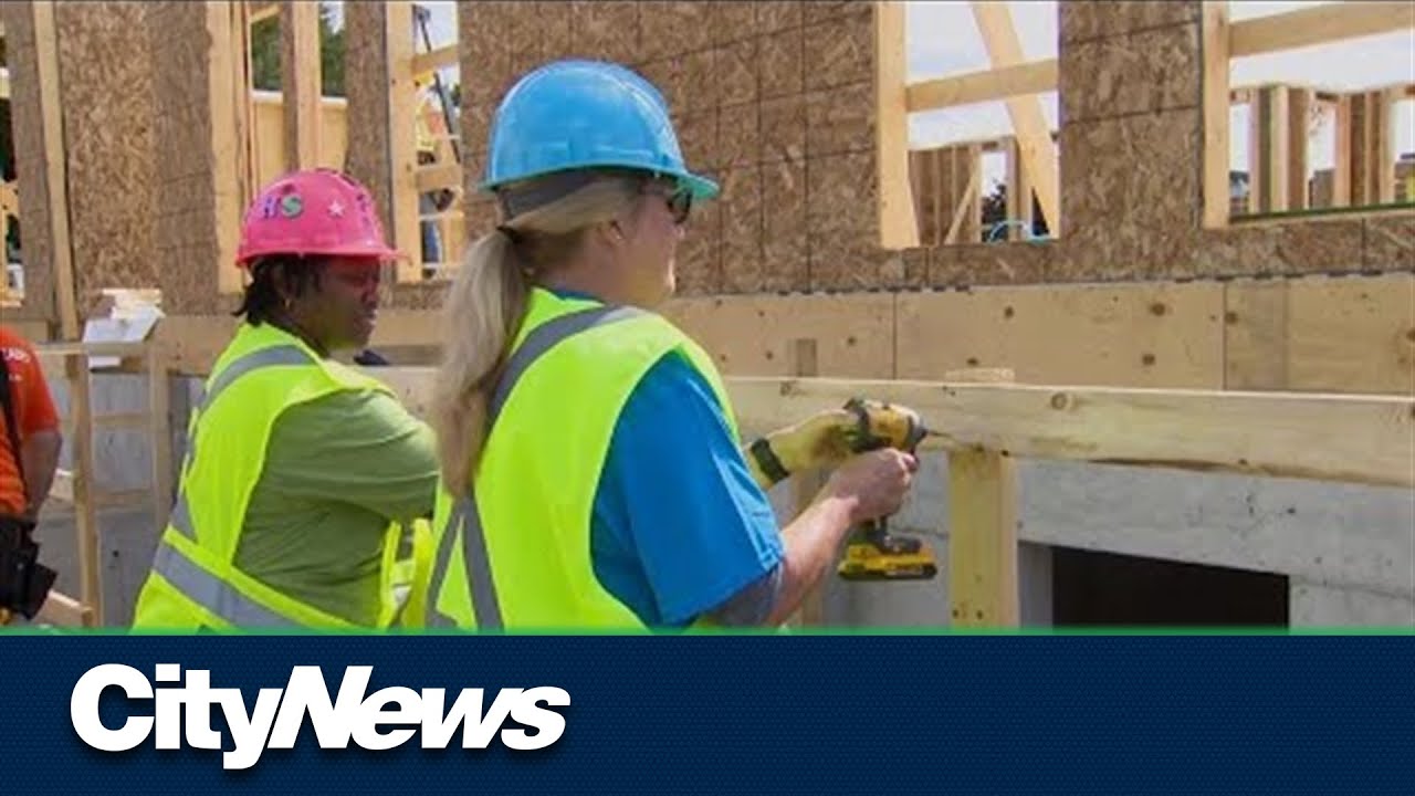 Women building homes for family's in need - YouTube