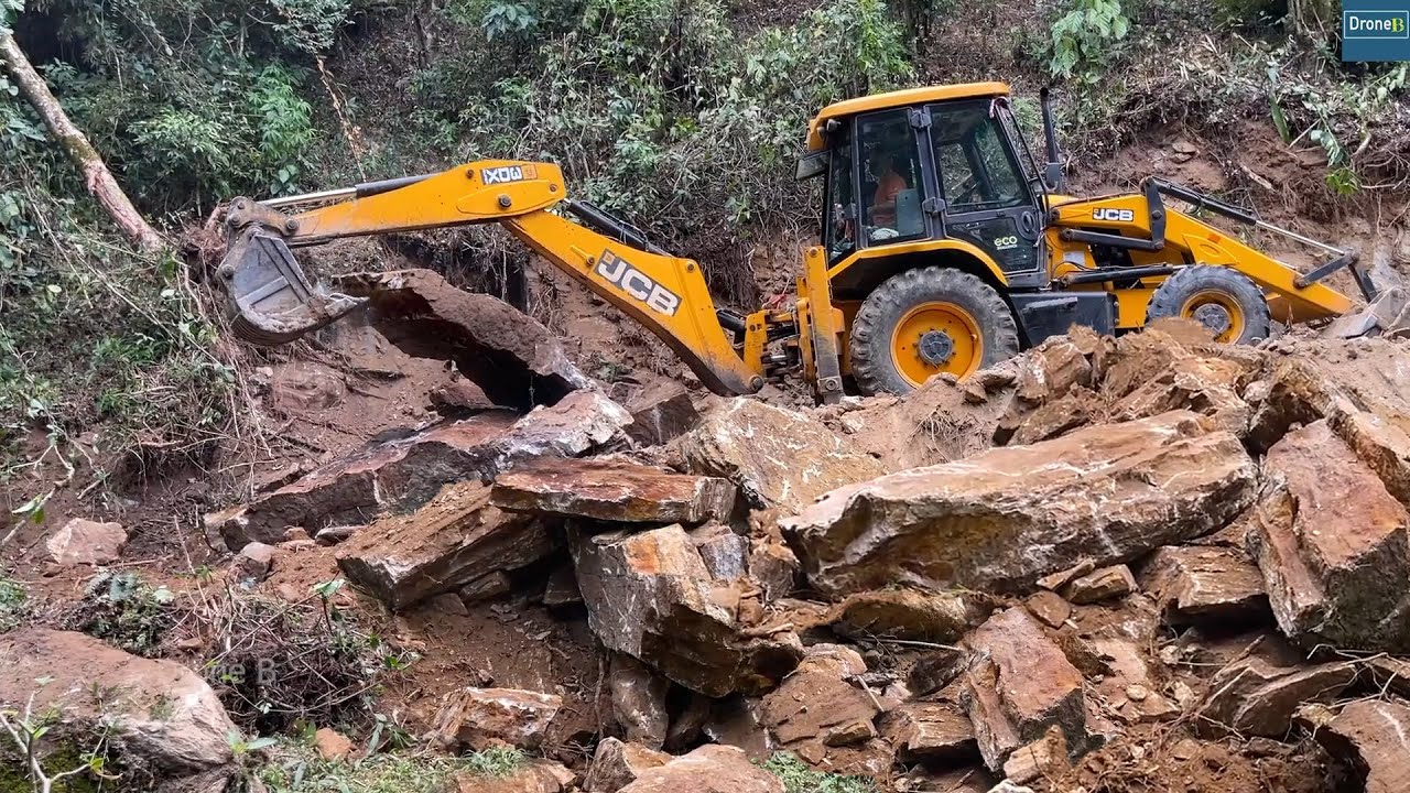 HUGE MOUNTAIN ROCKS Blocking New Mountain Road Track-Had to Break Them ...